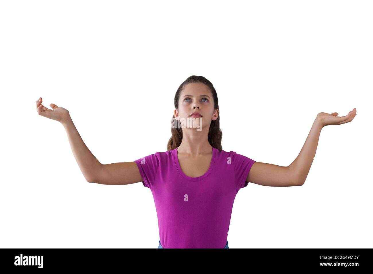Girl standing with hands raised Stock Photo - Alamy