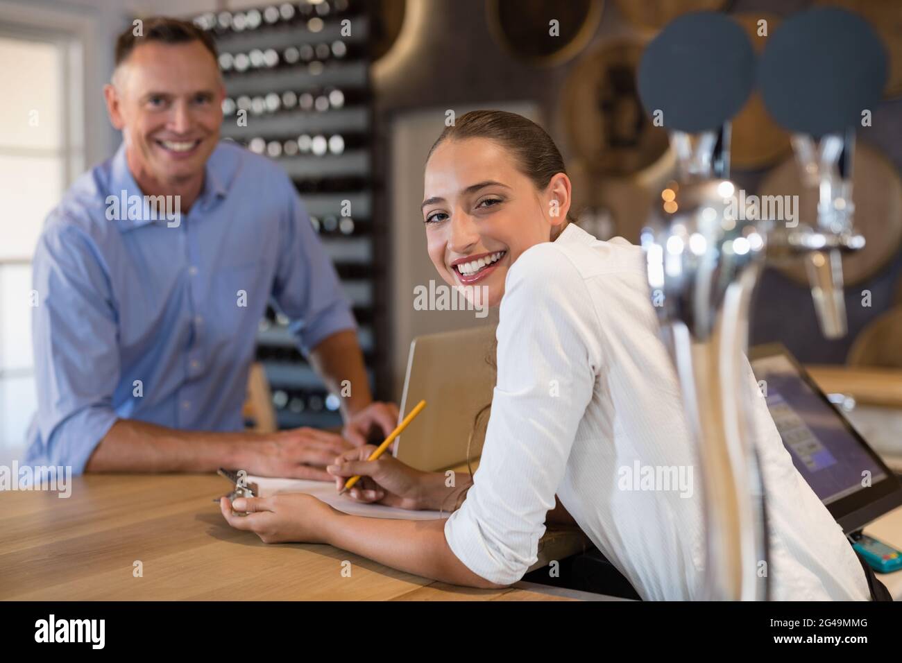 Hotel staff standing together smiling hi-res stock photography and ...