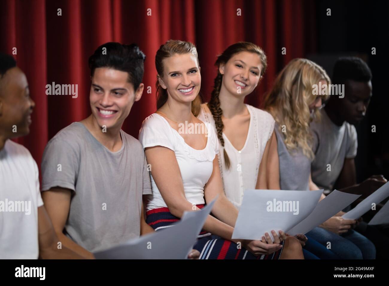 Actors reading their scripts on stage Stock Photo - Alamy