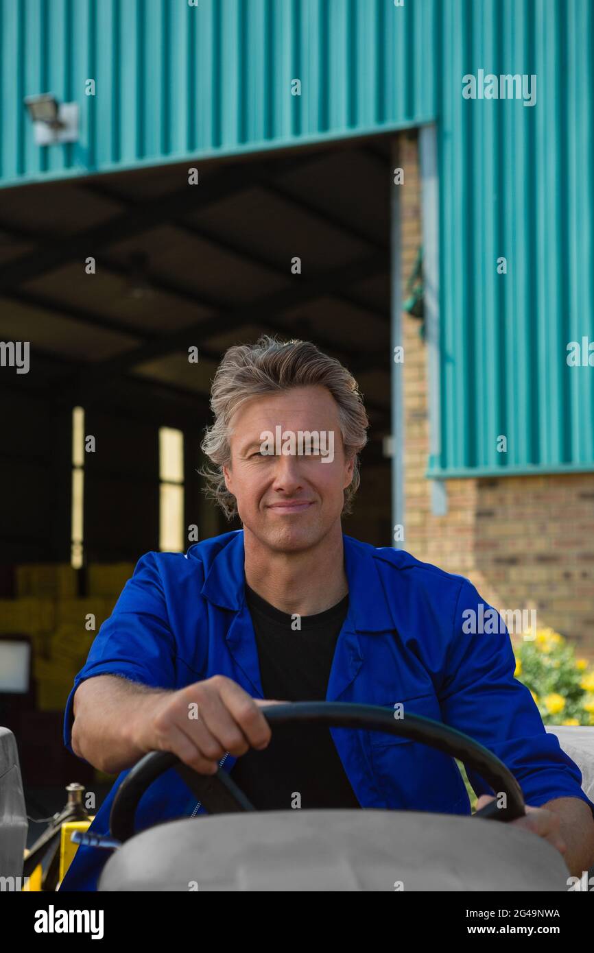 Portrait worker driving tractor hi-res stock photography and images - Alamy