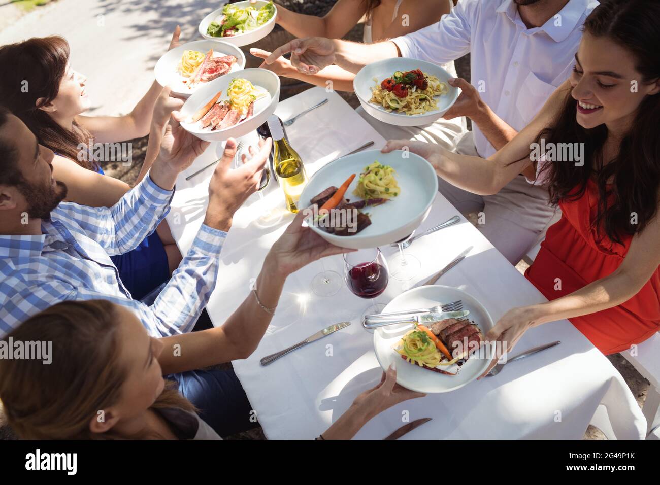 Group of friends having lunch Stock Photo - Alamy