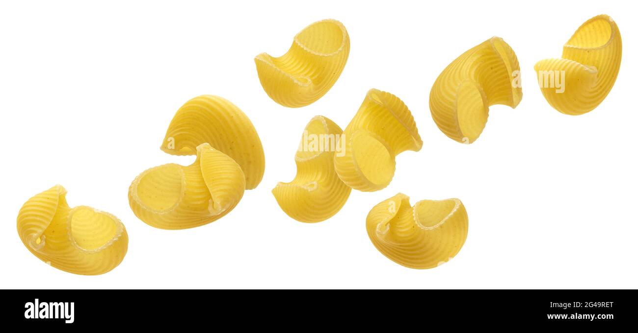 Falling pipe rigate pasta isolated on white background Stock Photo - Alamy