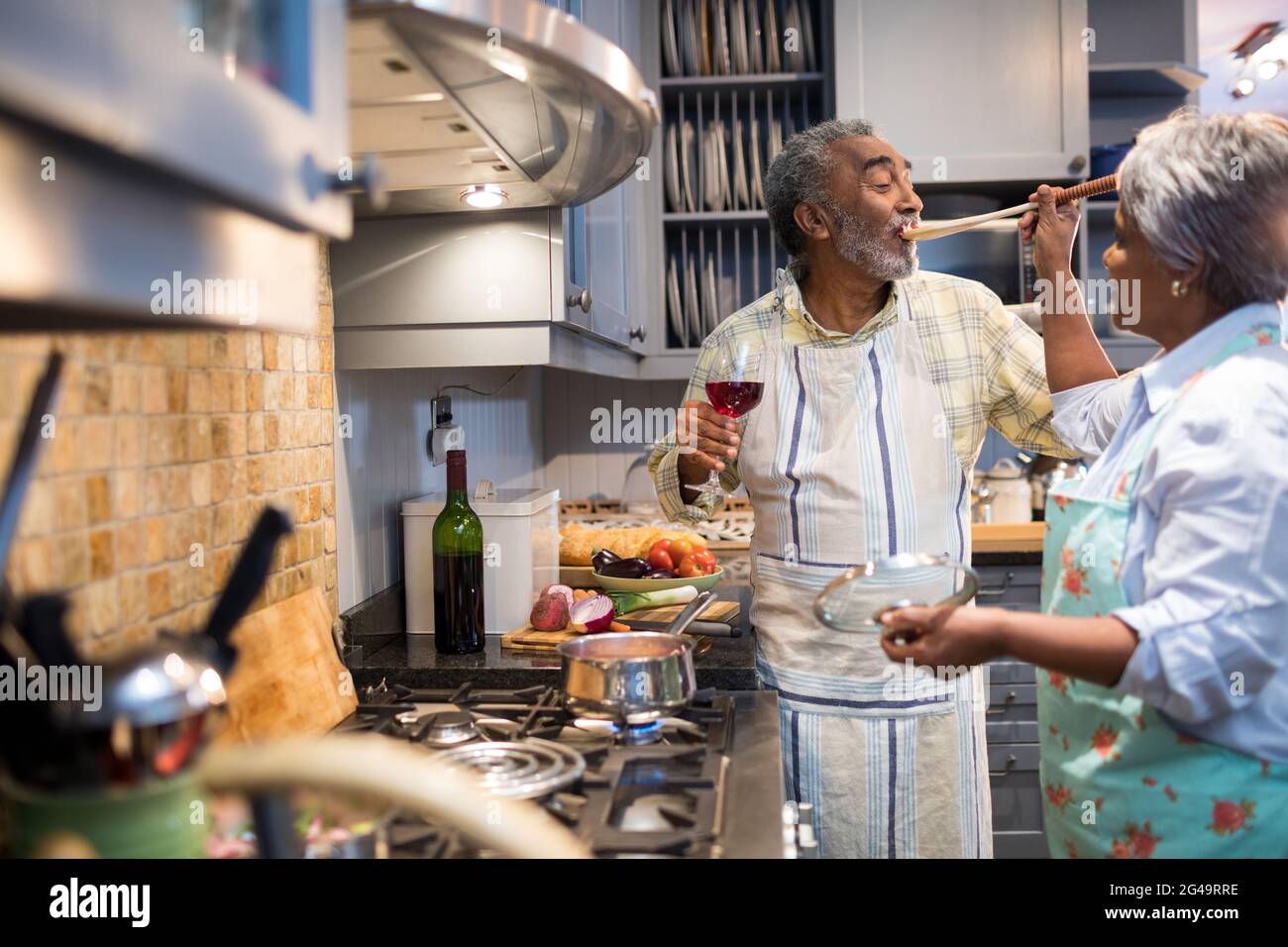 Feeding man in kitchen elderly hi-res stock photography and images - Alamy