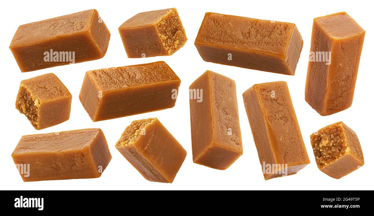 Caramel candies isolated on white background Stock Photo - Alamy
