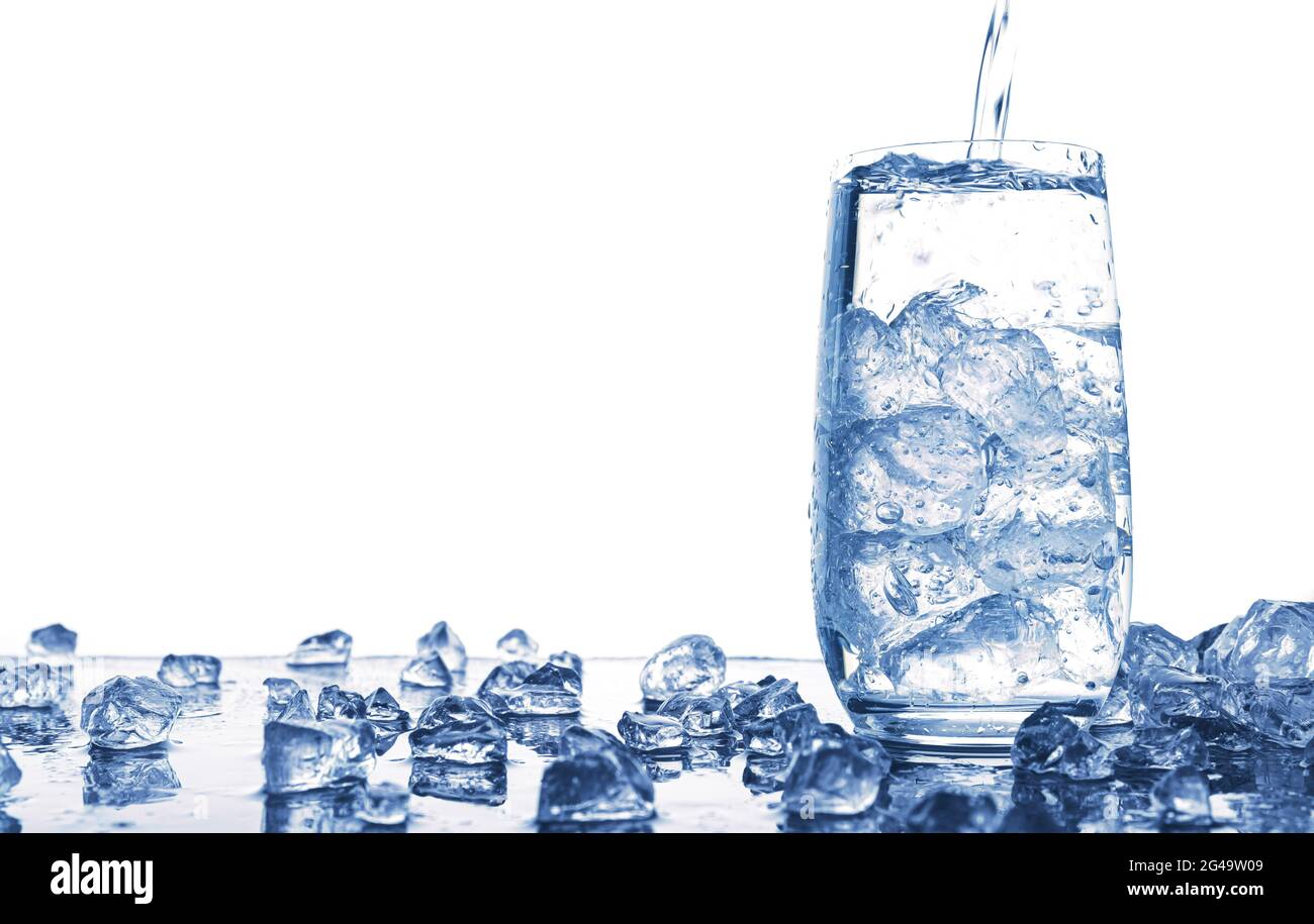 Pouring water into glass with ice isolated on white background Stock ...