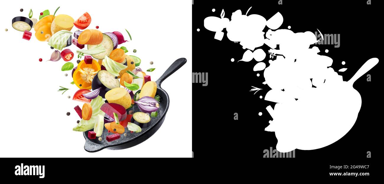 Different vegetables falling into frying pan on white background Stock ...