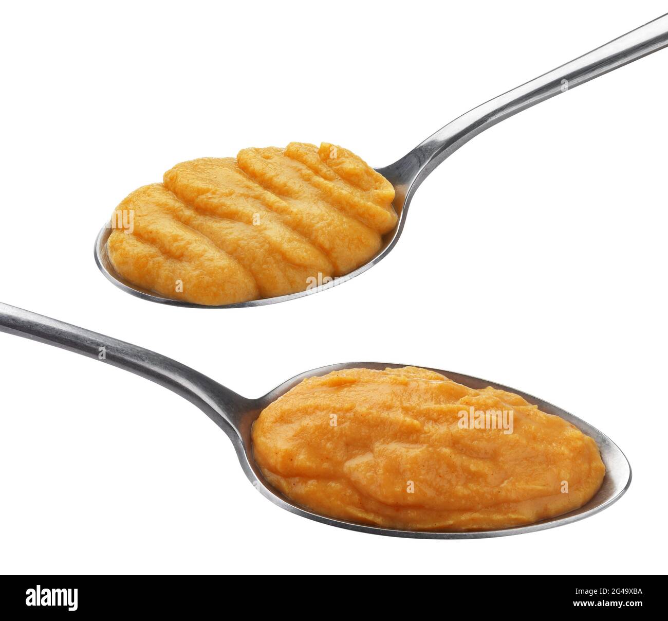 Pumpkin and carrot puree in spoon isolated on white background Stock ...