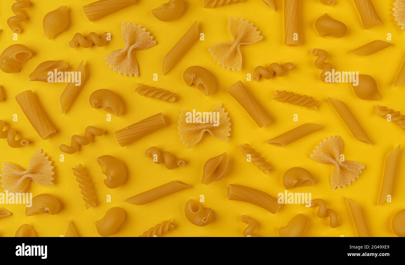 Italian pasta pattern, different pasta types on yellow background, flat ...
