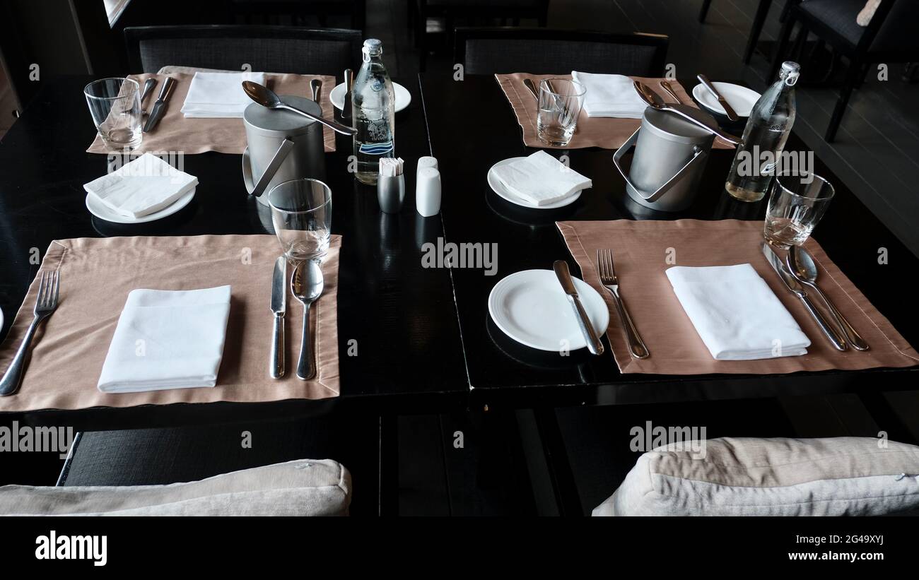 silverware food water and ice table place setting ready for guest Stock ...