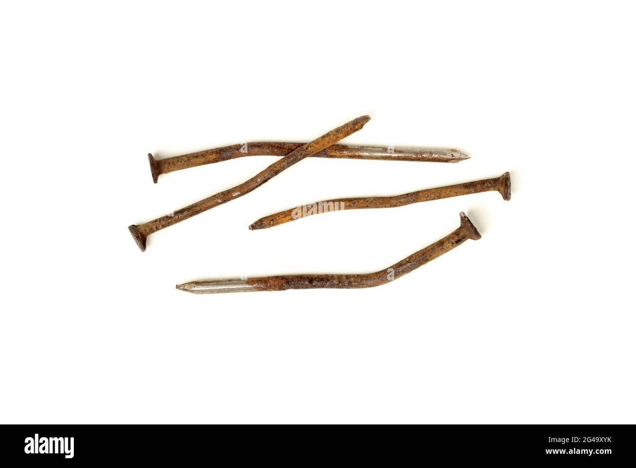 Old bent rusty nails isolated on white background Stock Photo - Alamy