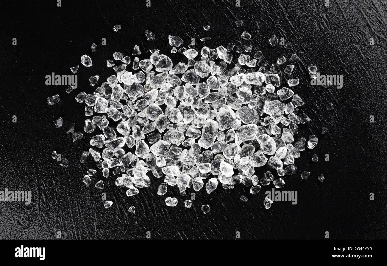Pile of crushed ice on black stone background Stock Photo - Alamy