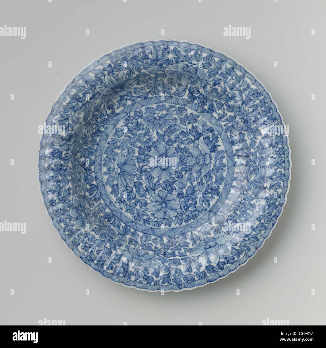 Plate with Fluted Sides and Continuous Flower Pattern. Porcelain plate ...