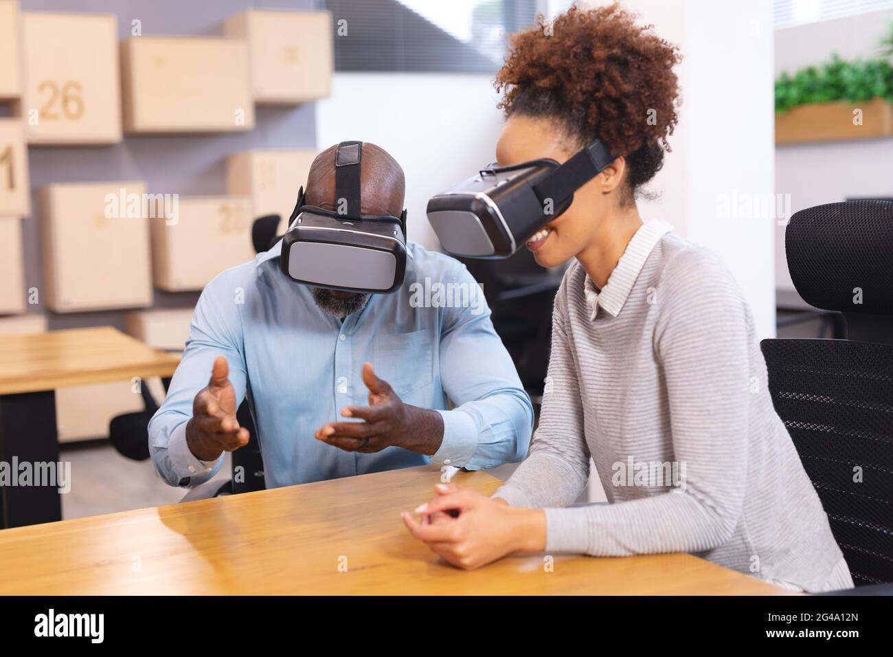 Using vr headsets diverse female hi-res stock photography and images ...