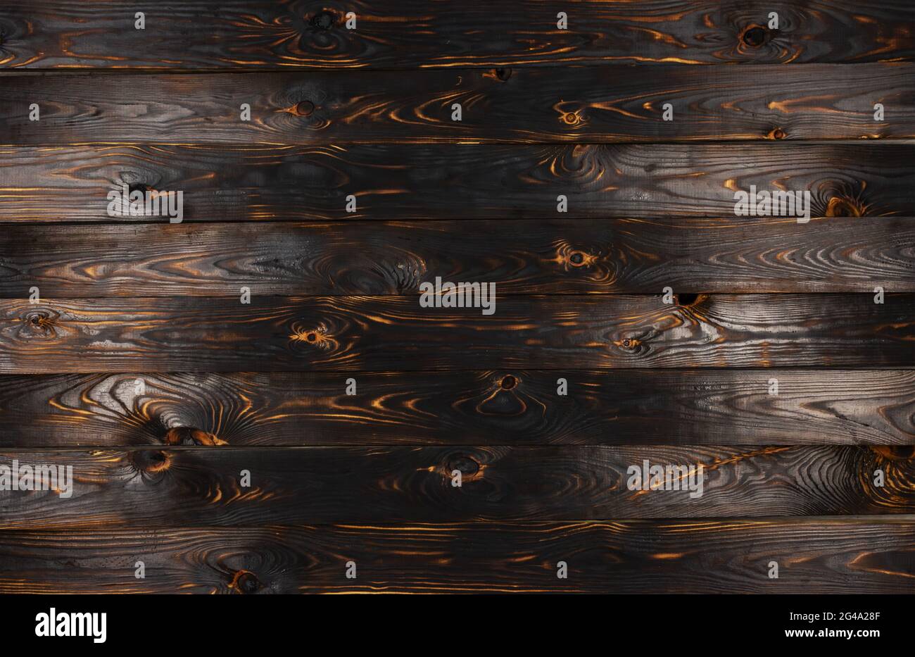 Burnt wooden board, black charcoal wood texture, burned barbecue ...