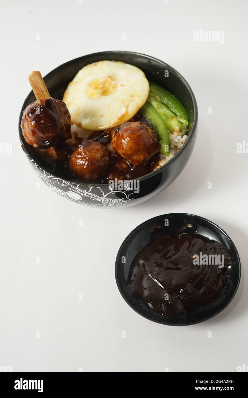 Fried Rice Served With Meatballs Satay and Sunny Side Up Stock Photo ...