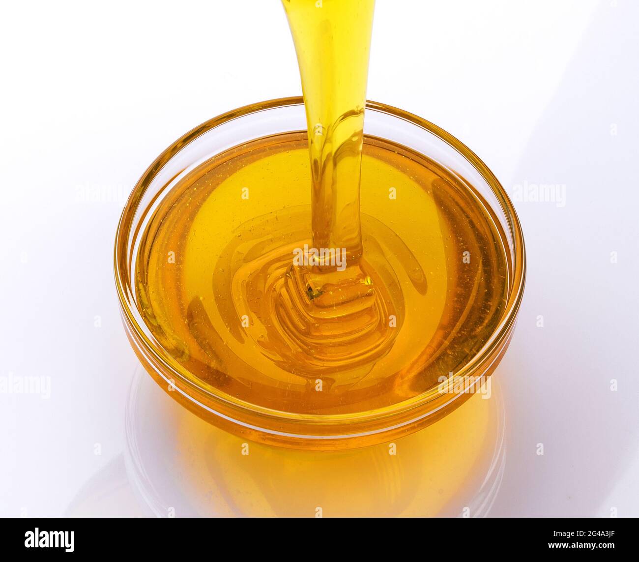 Honey pouring bowl hi-res stock photography and images - Alamy