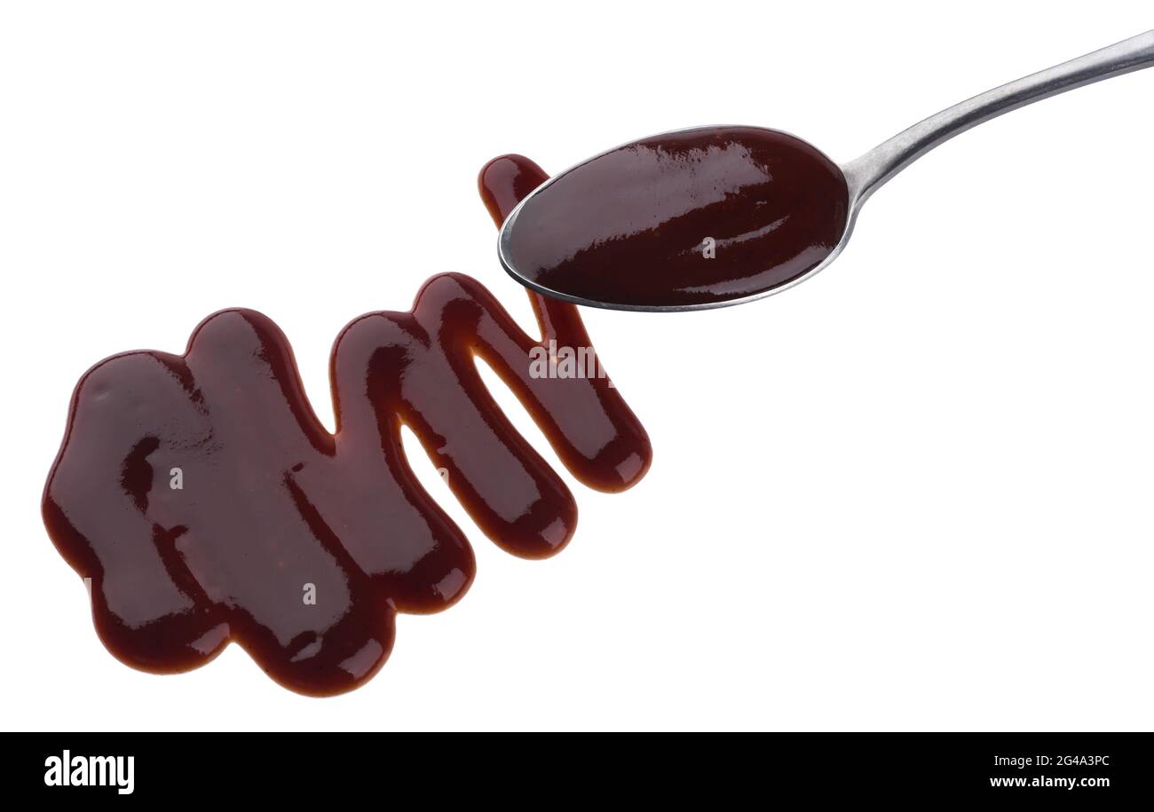 Barbecue sauce. Splashes and spilled grill sauce with spoon isolated on ...