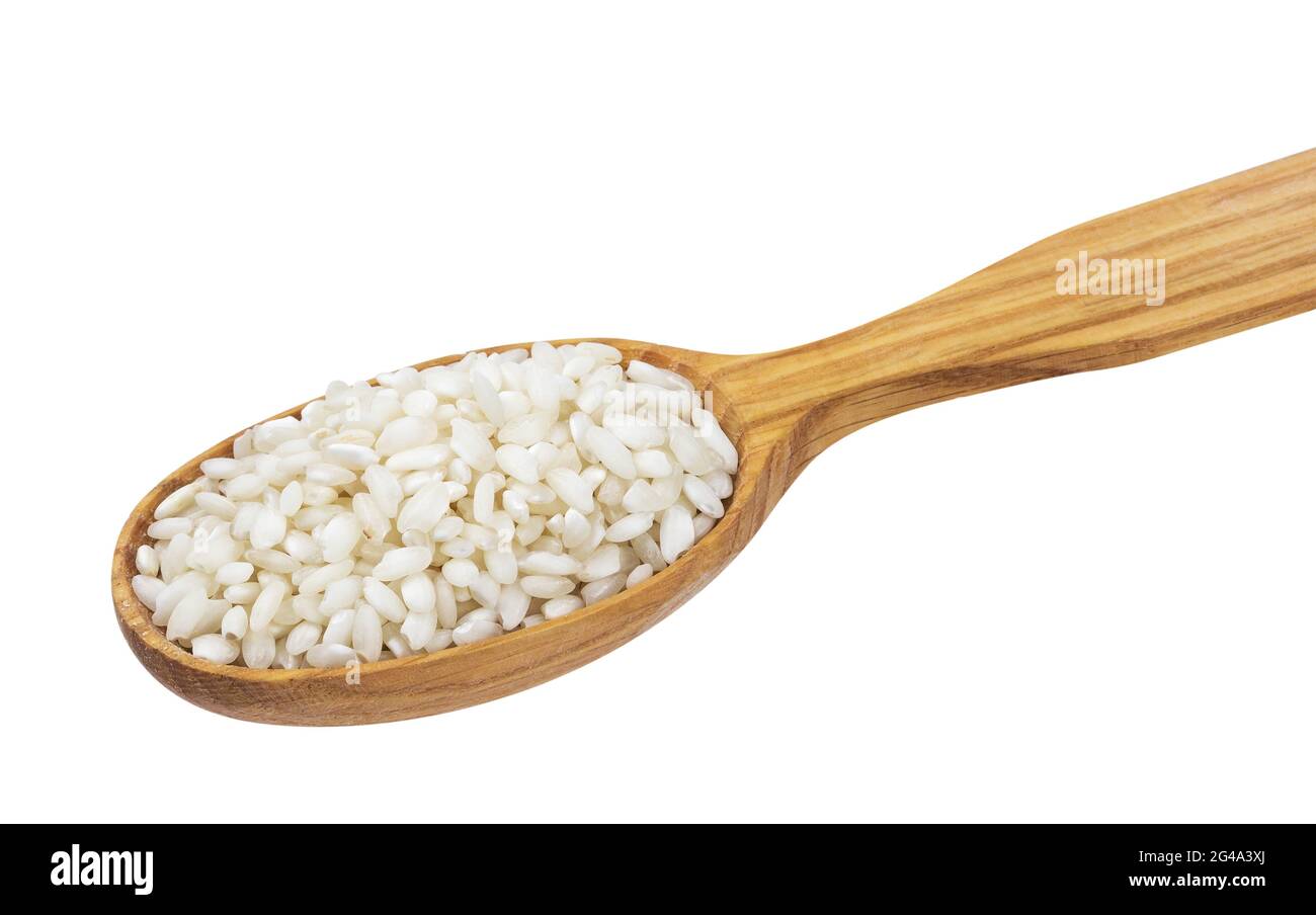 raw risotto rice on a wooden shovel Stock Photo - Alamy