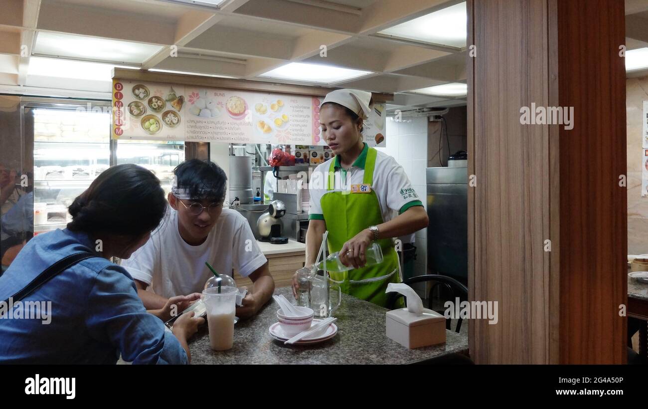 Chinese waitress serving in restaurant hi-res stock photography and ...