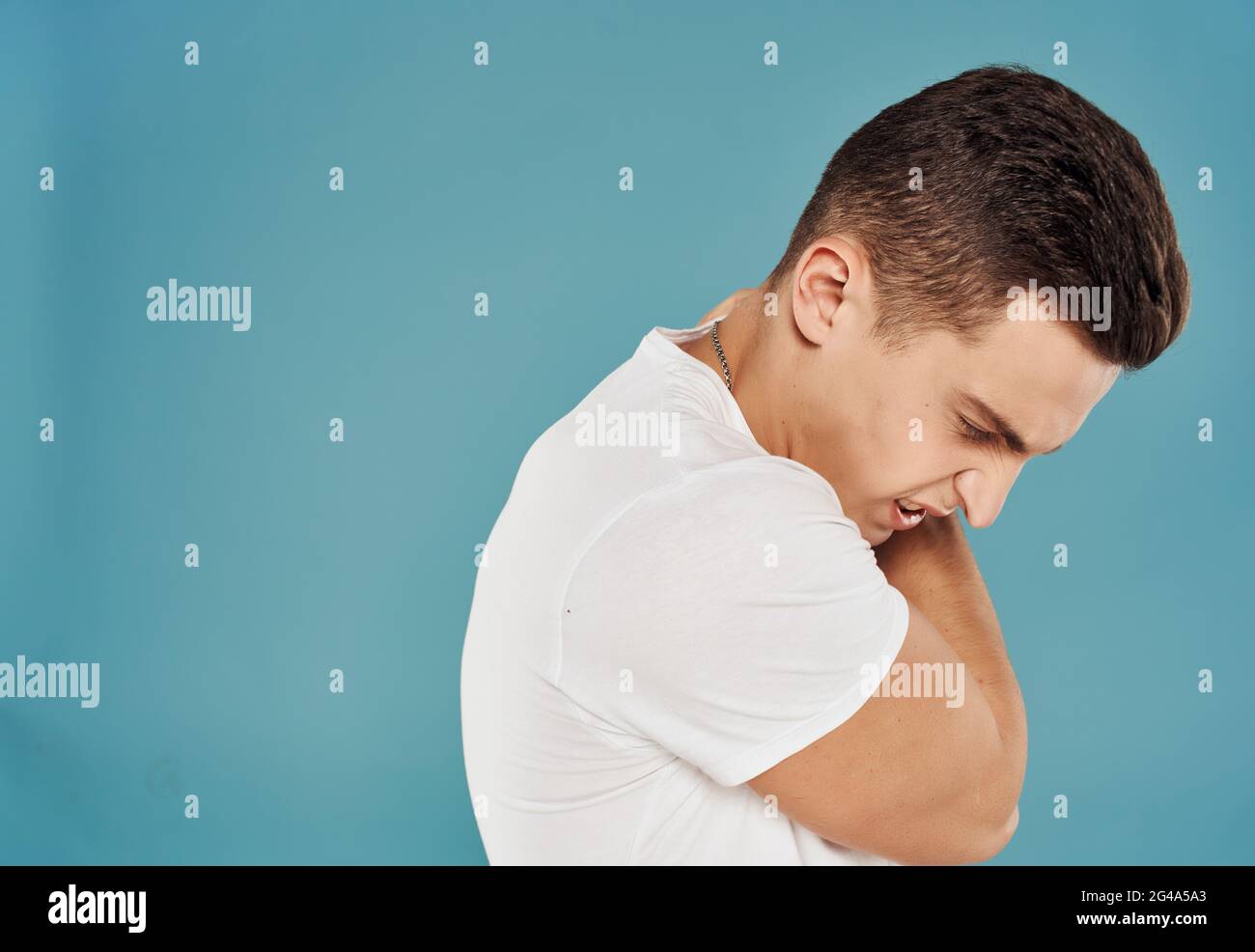 man with serious facial expression emotions close-up blue background ...