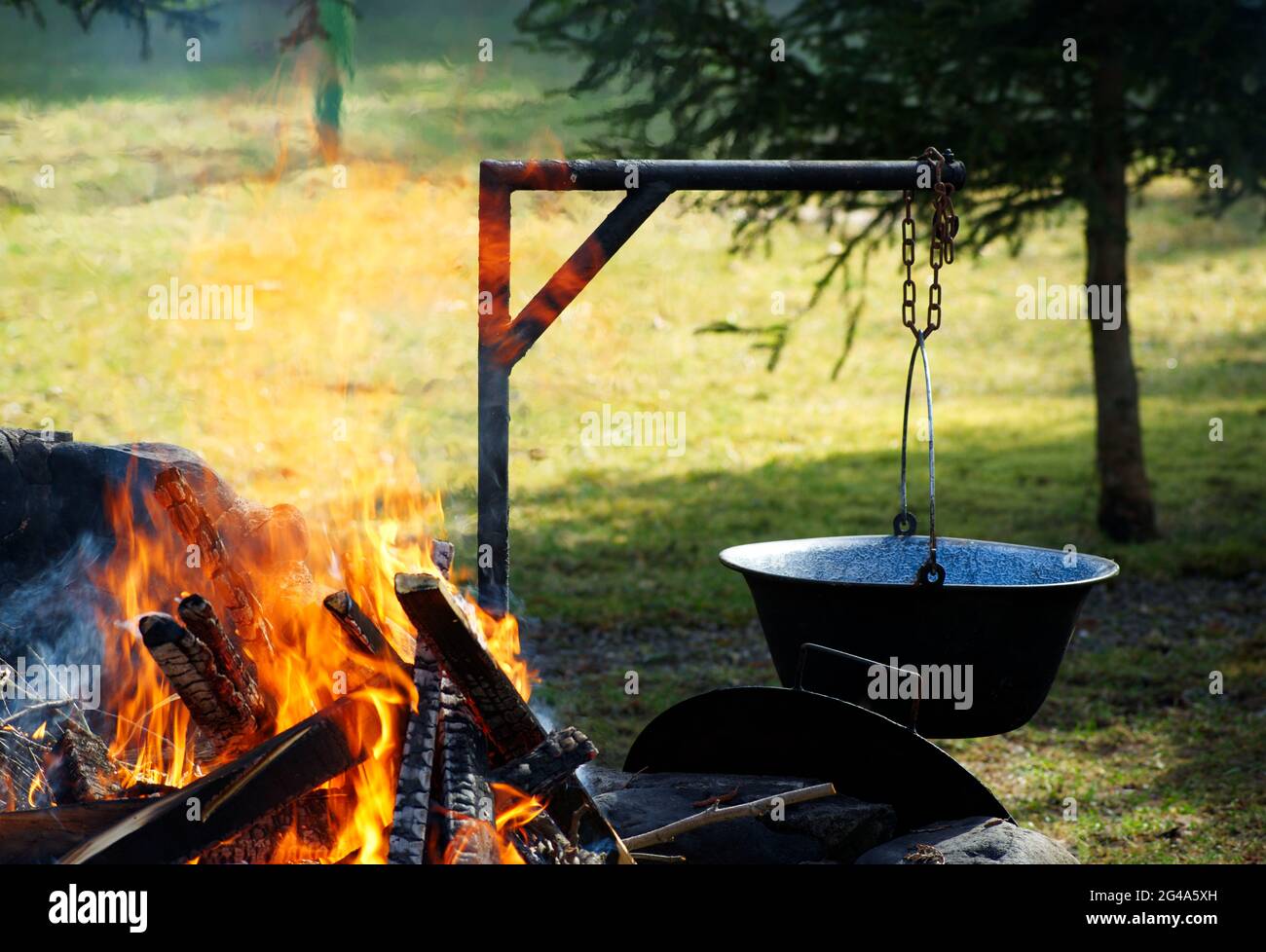 Fire camp, food preparing Stock Photo - Alamy
