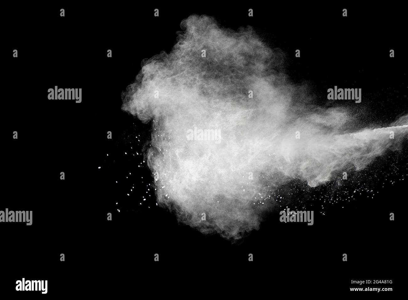 White powder explosion isolated on black background.White dust ...
