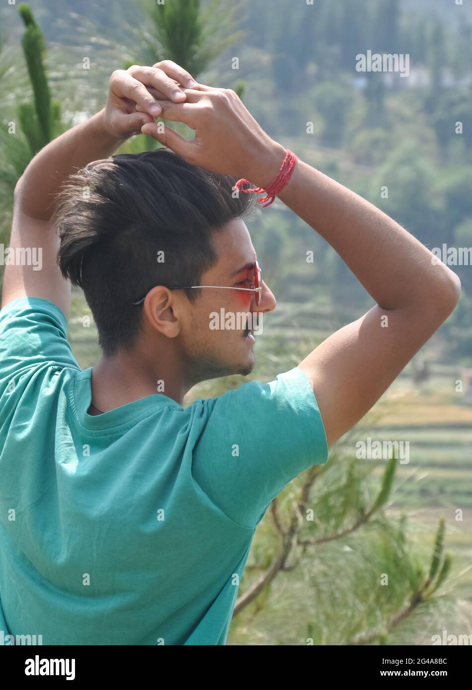 Back view of a young guy wearing sunglass and posing in outdoor Stock ...