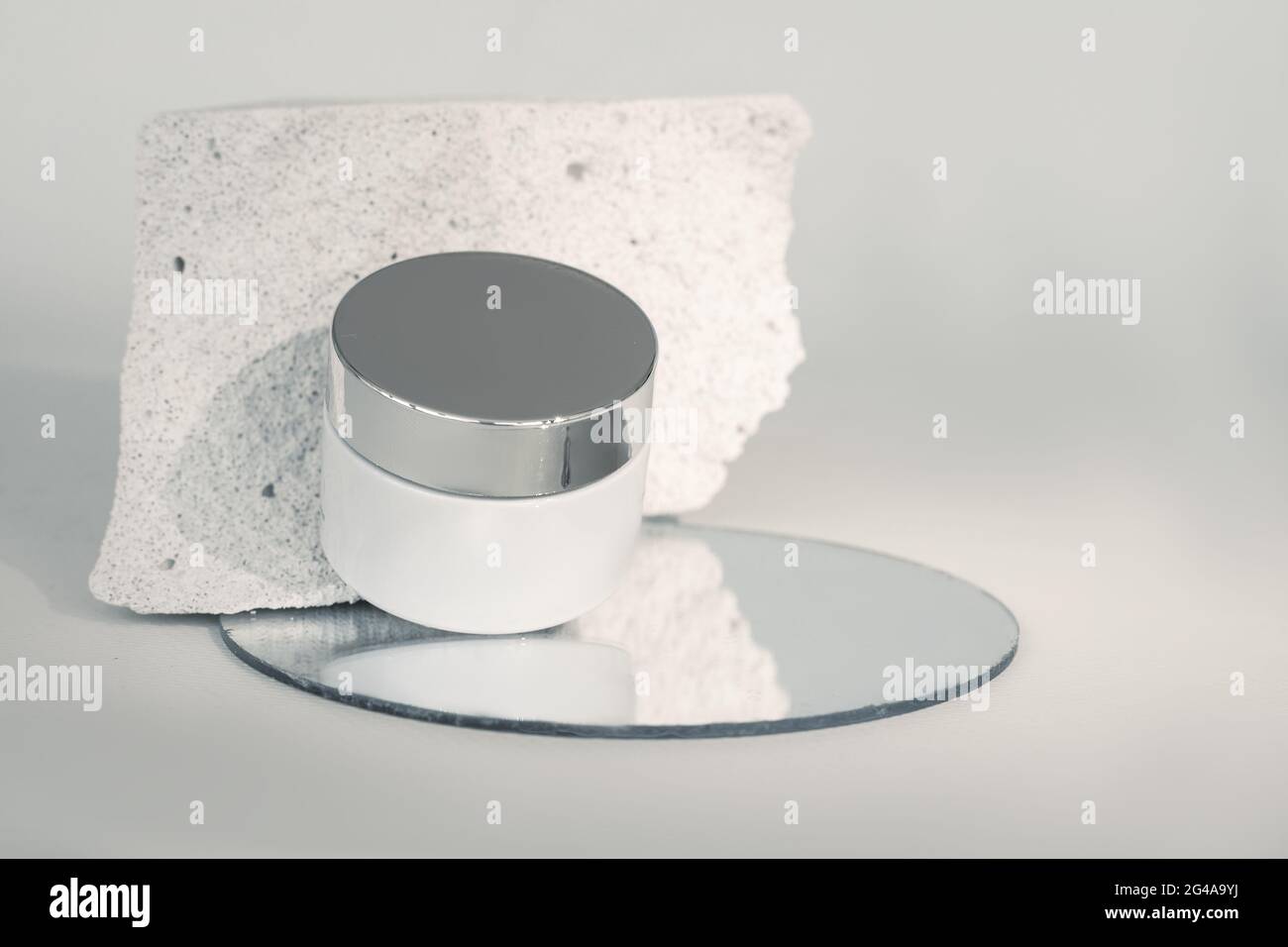 cream box on piece of concrete in cut. Porous structure of concrete is ...