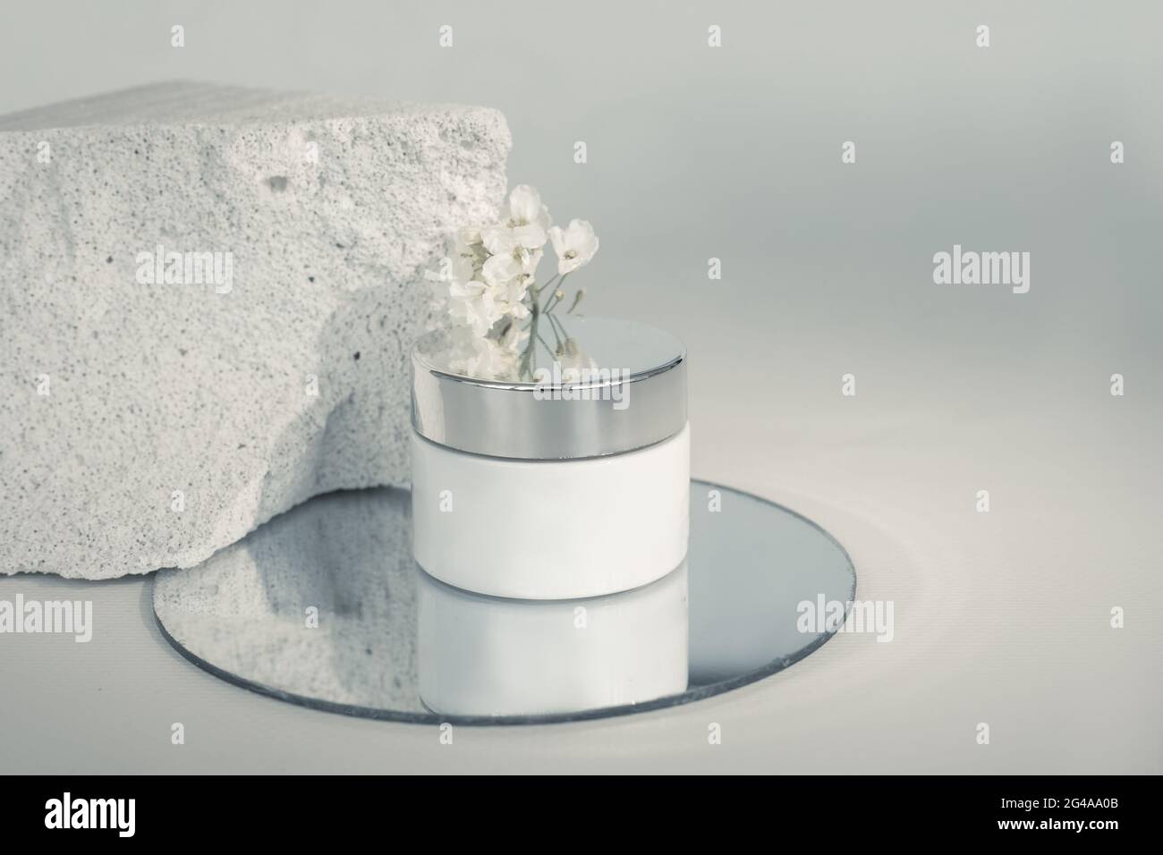 cream box on piece of concrete in cut. Porous structure of concrete is ...