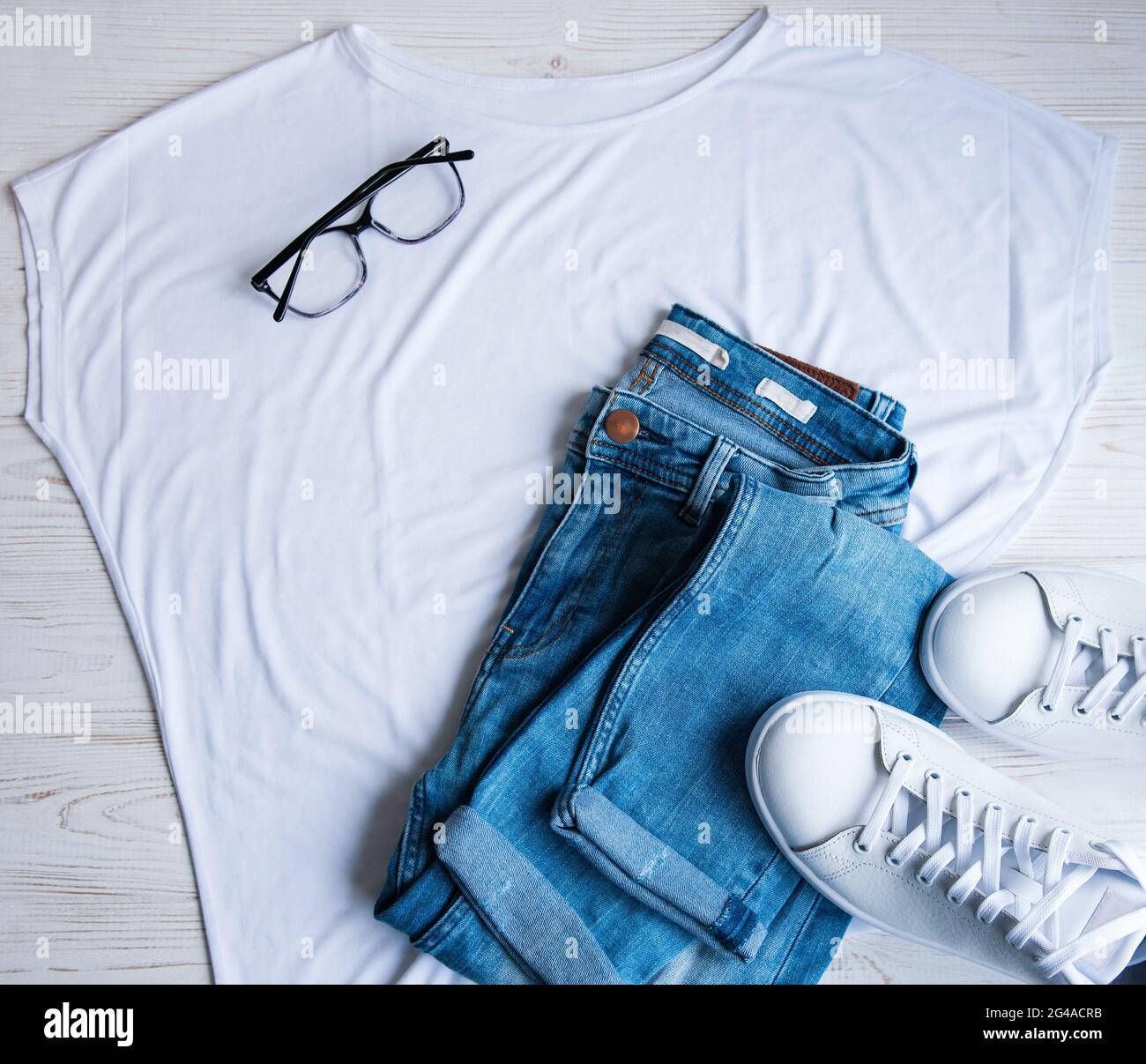 Stylish female clothes set. Woman outfit on wooden background. Blue ...