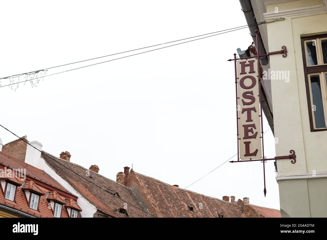Hostel sign on the wall of an old building Stock Photo - Alamy