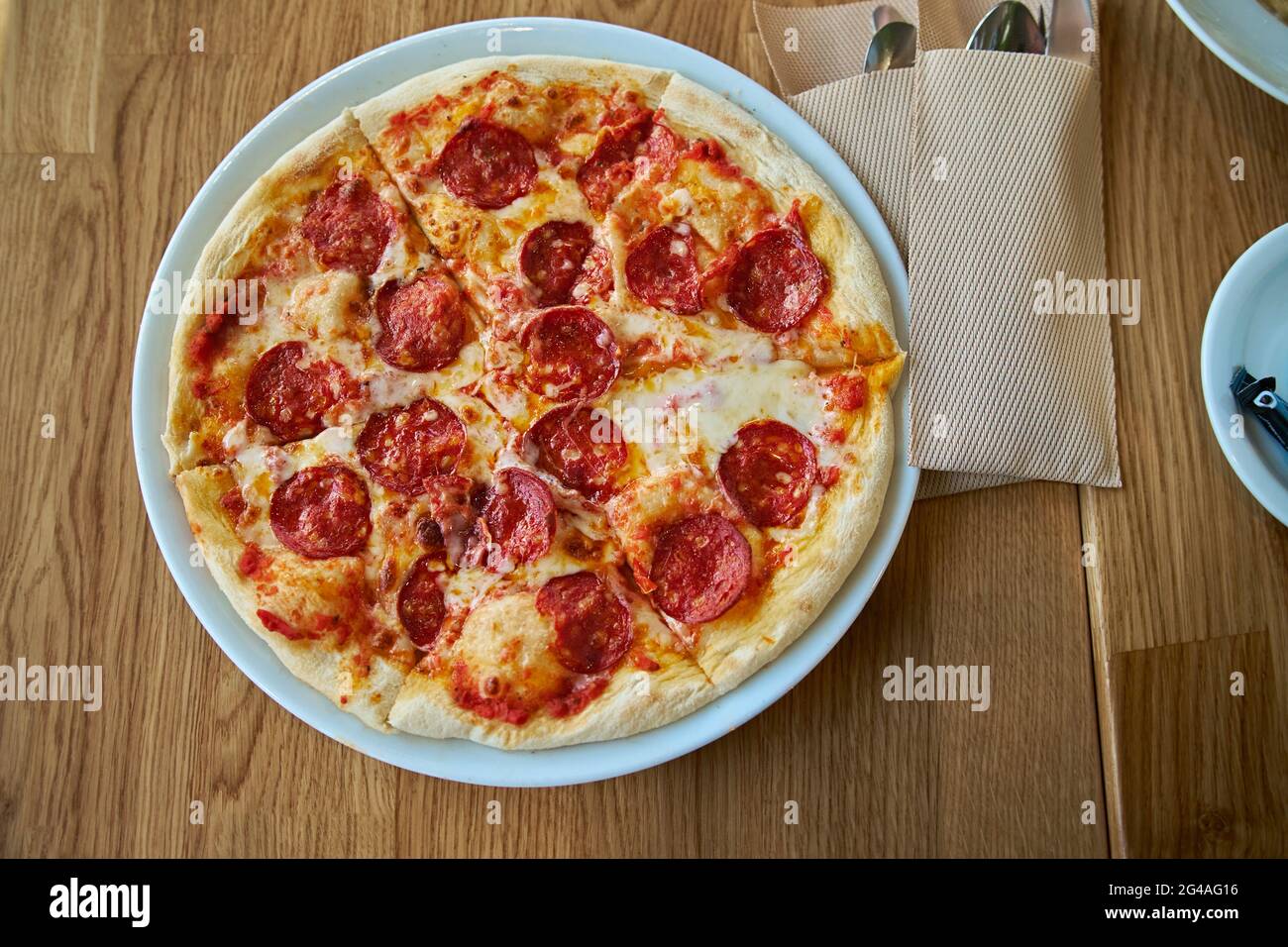 Top view of Pepperoni pizza on plate on the table Stock Photo - Alamy