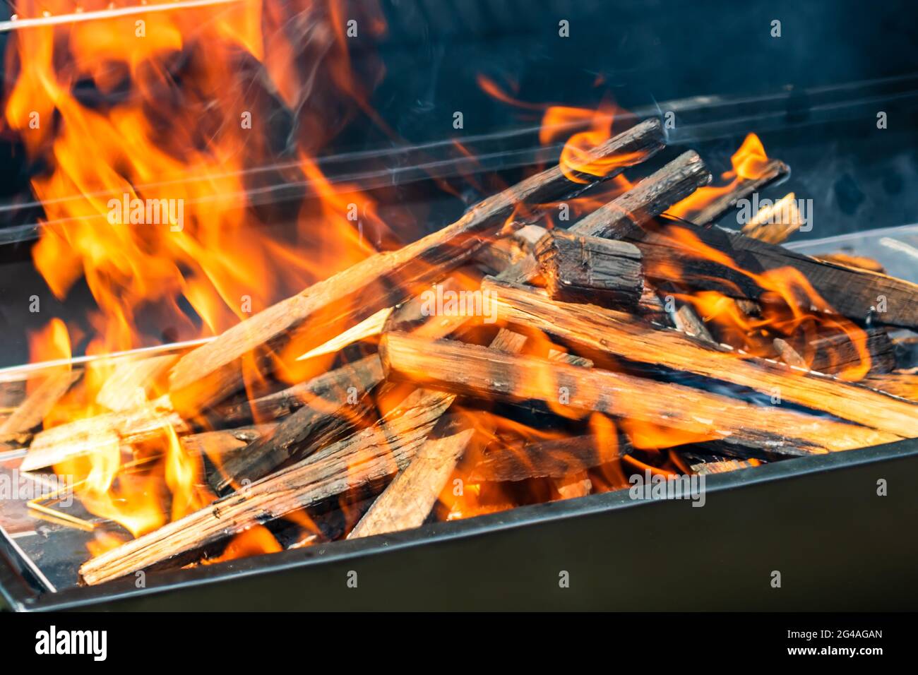 Barbecue grill pit with glowing and flaming hot open fire with red ...