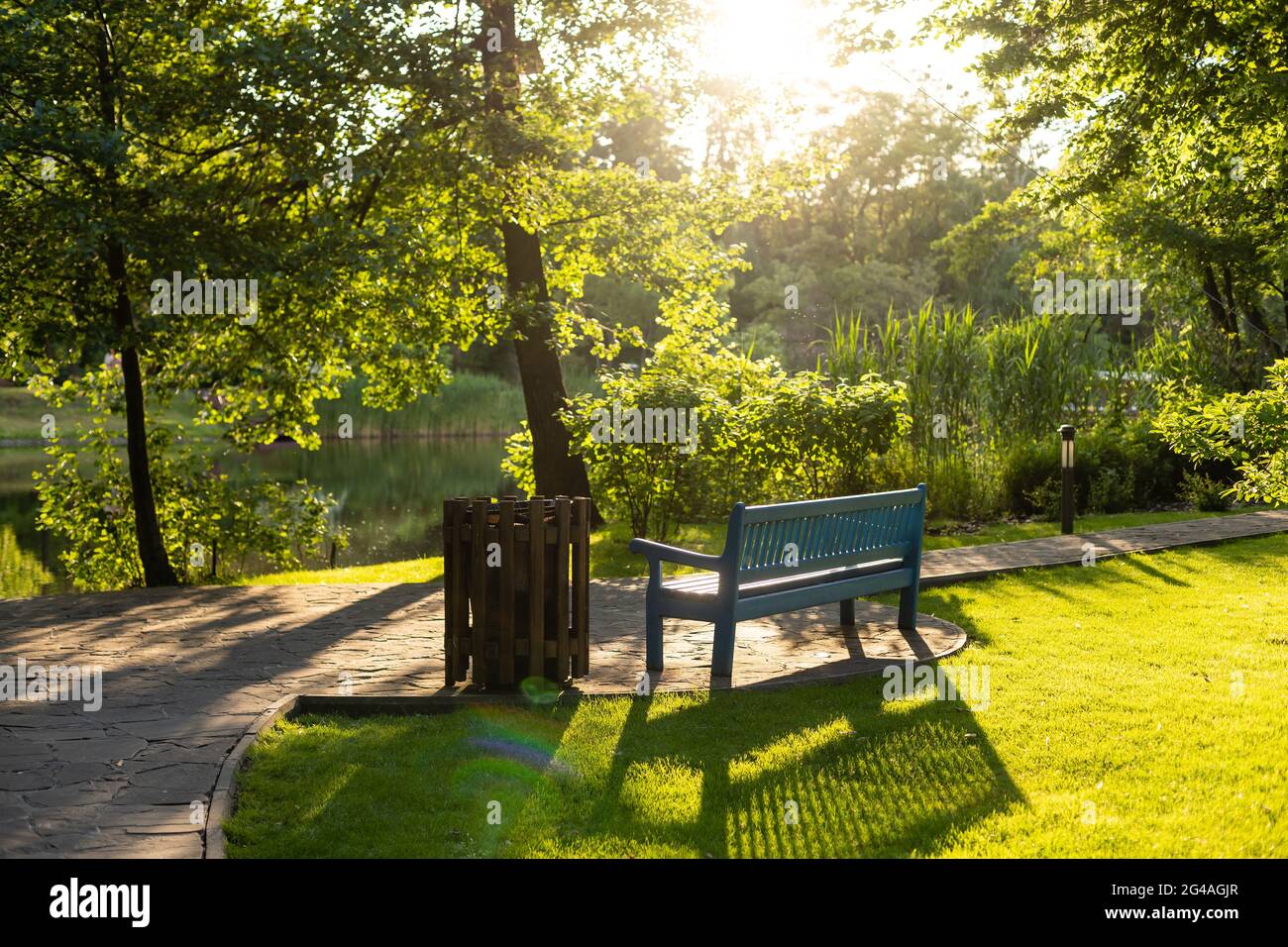 romantic bench in peaceful park in spring Stock Photo - Alamy