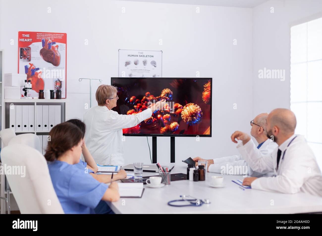 Doctor explaining evolution virus hi-res stock photography and images ...