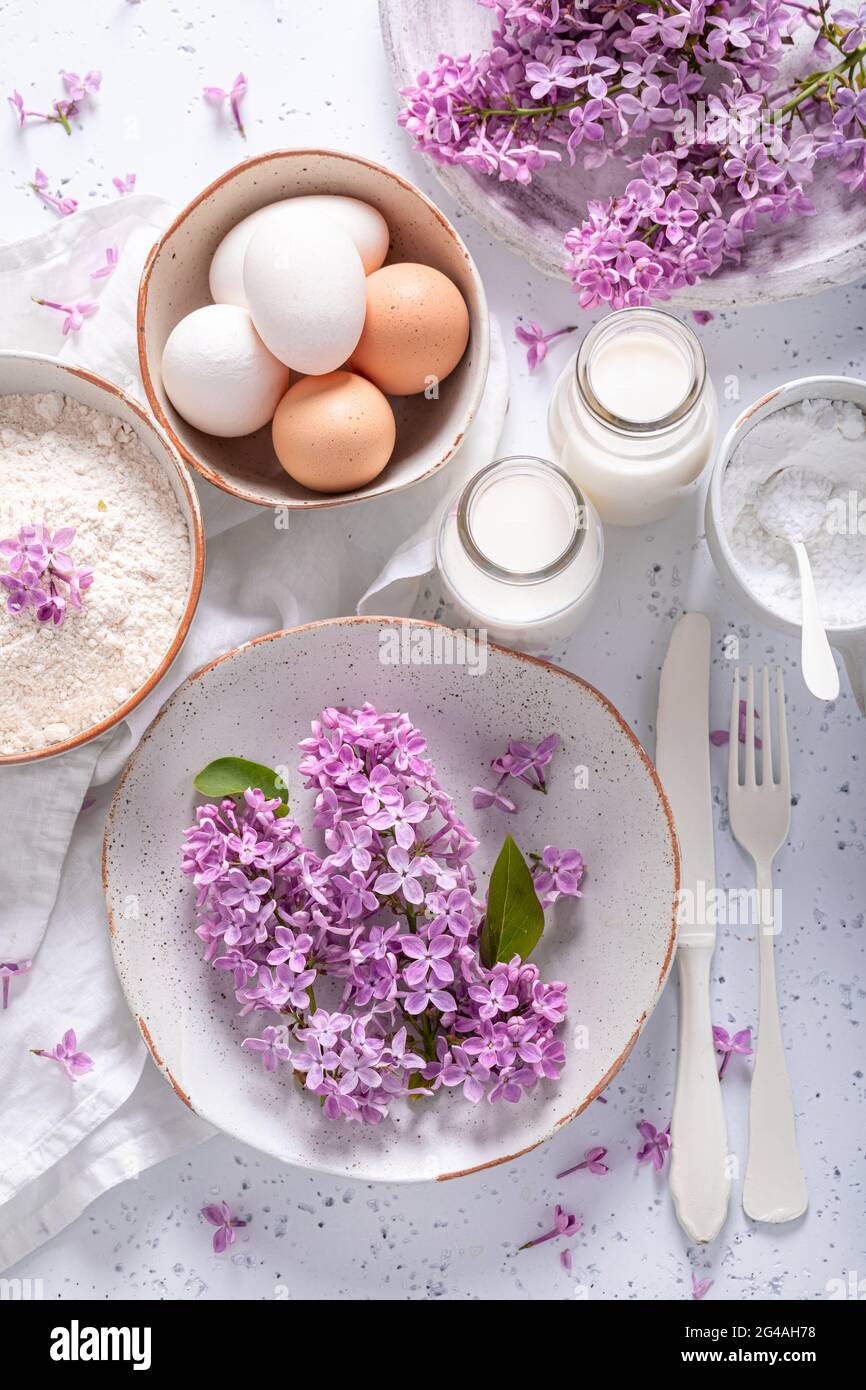 Ingredients for fried lilac flower in pancake dough. Sweet snack. Lilac ...