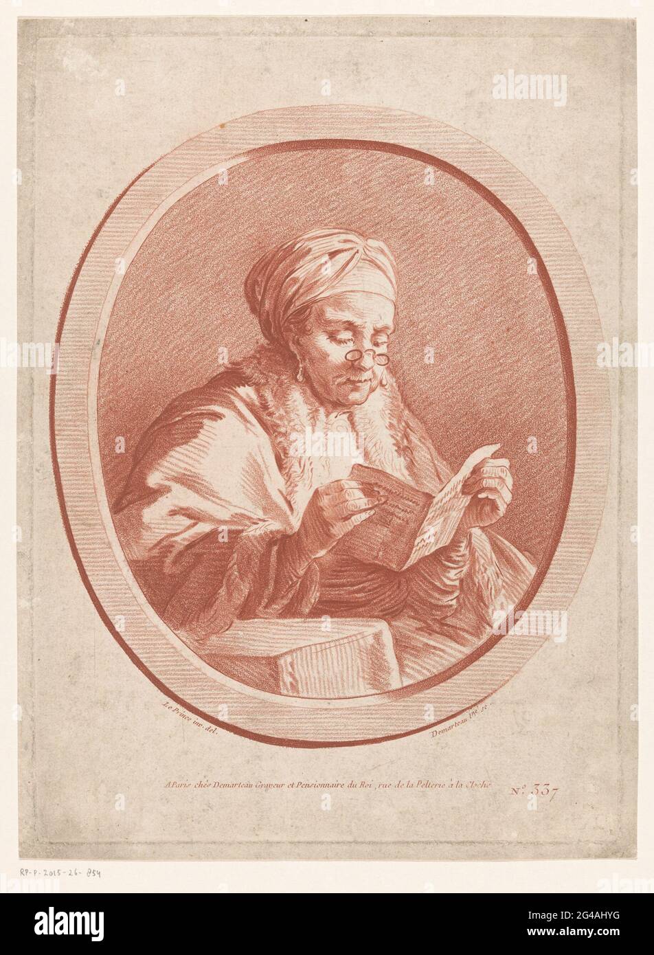 Old woman reads a letter. The woman wears a headscarf and a cloak off ...