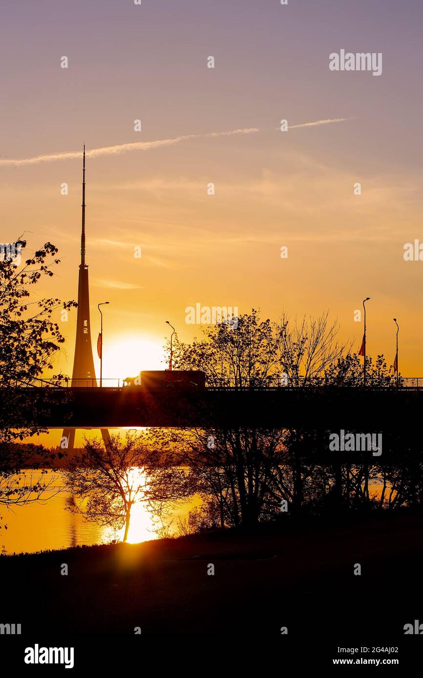 Evening landscape with bridge silhouette on sunset sky background. Riga ...