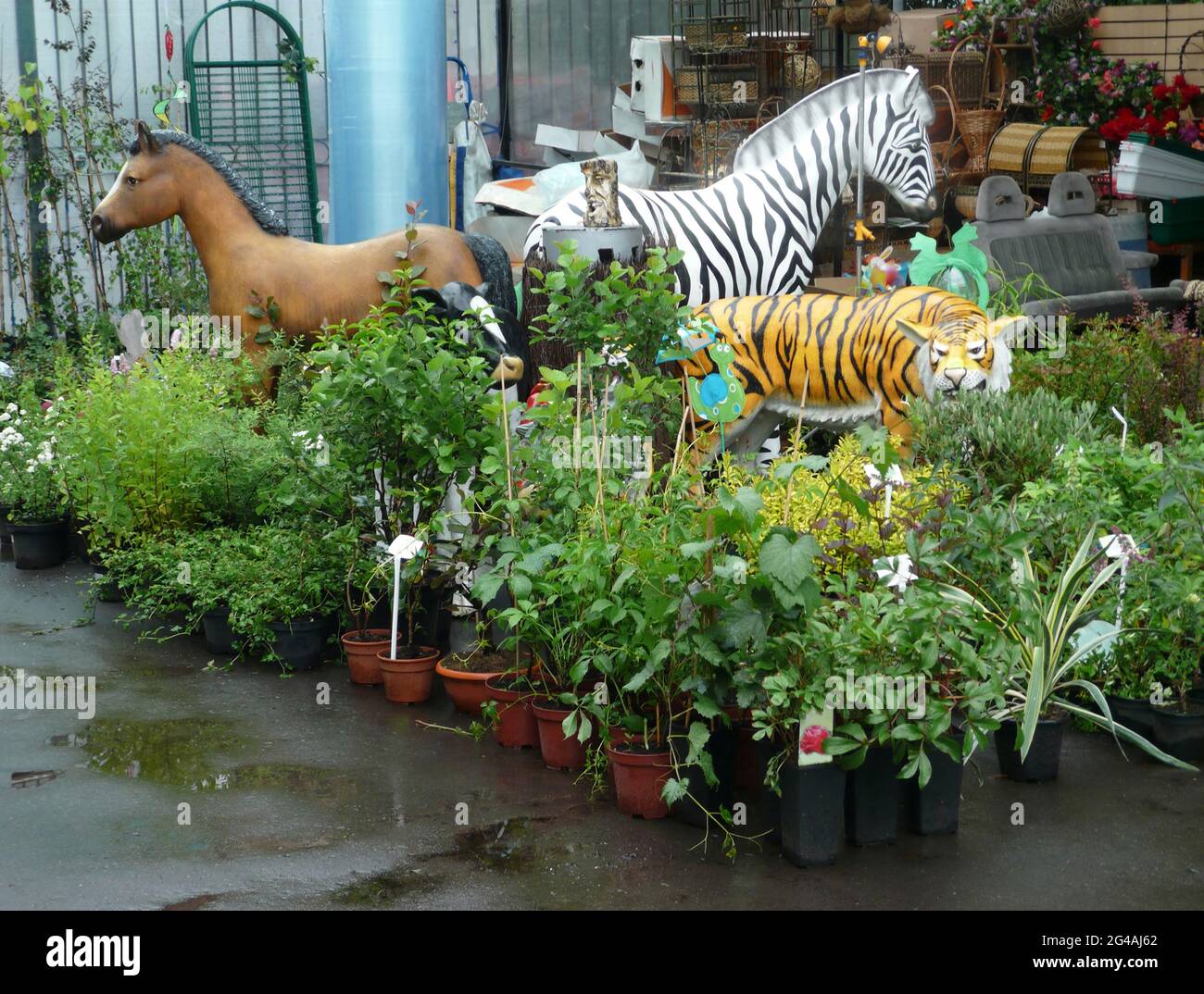 toy animals in garden at day Stock Photo - Alamy