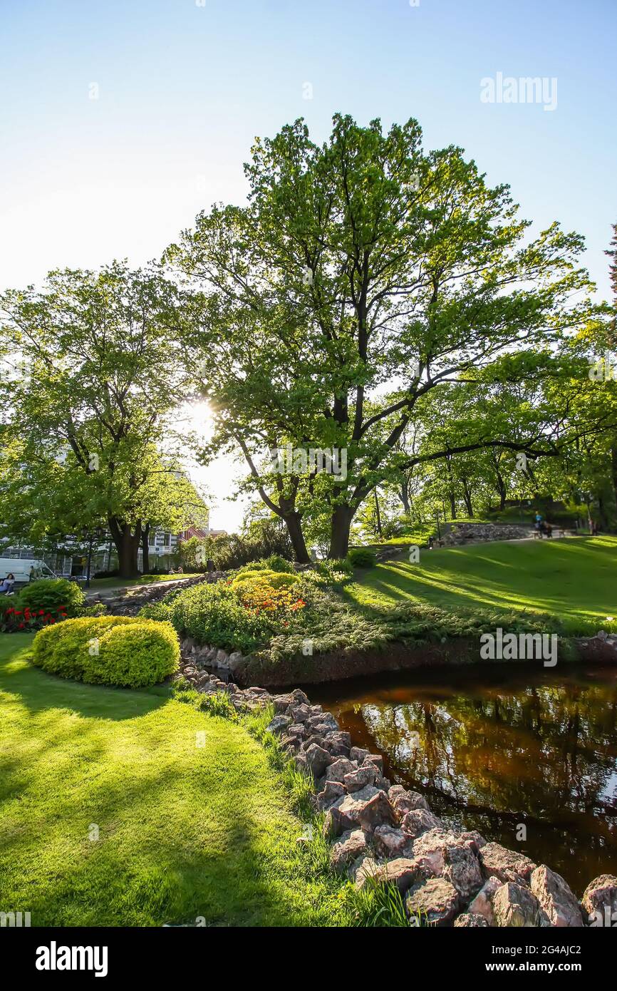 Summer landscape with artificial small waterfall in park Stock Photo ...
