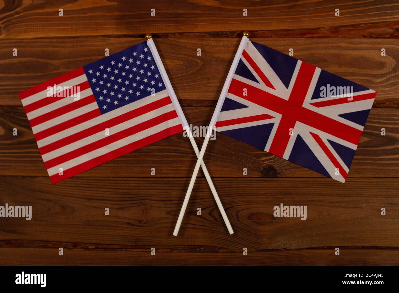 Flag of USA and flag of Great Britain crossed with each other. USA vs ...
