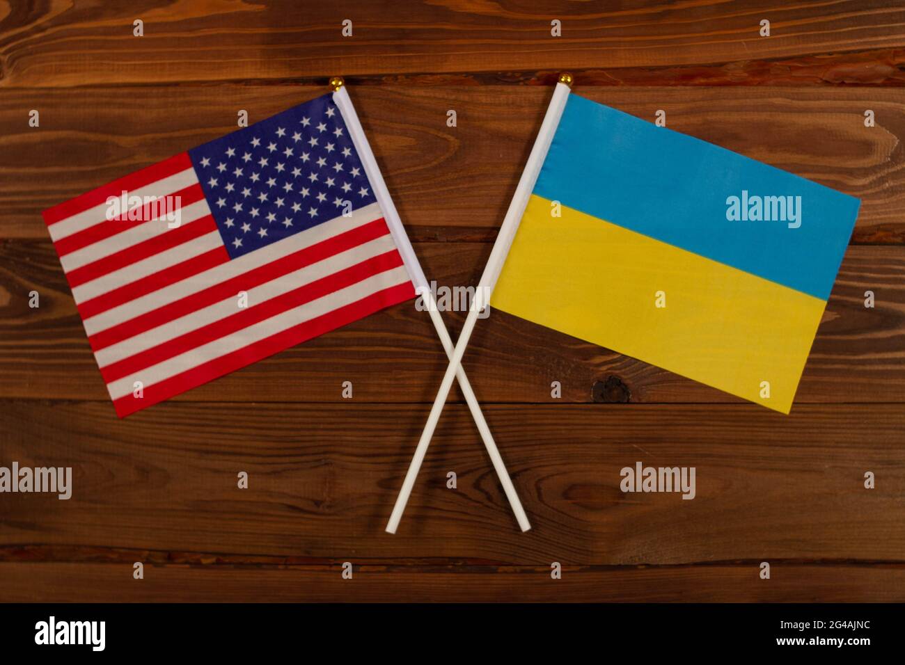 Flag of USA and flag of Ukraine crossed with each other. USA vs Ukraine ...