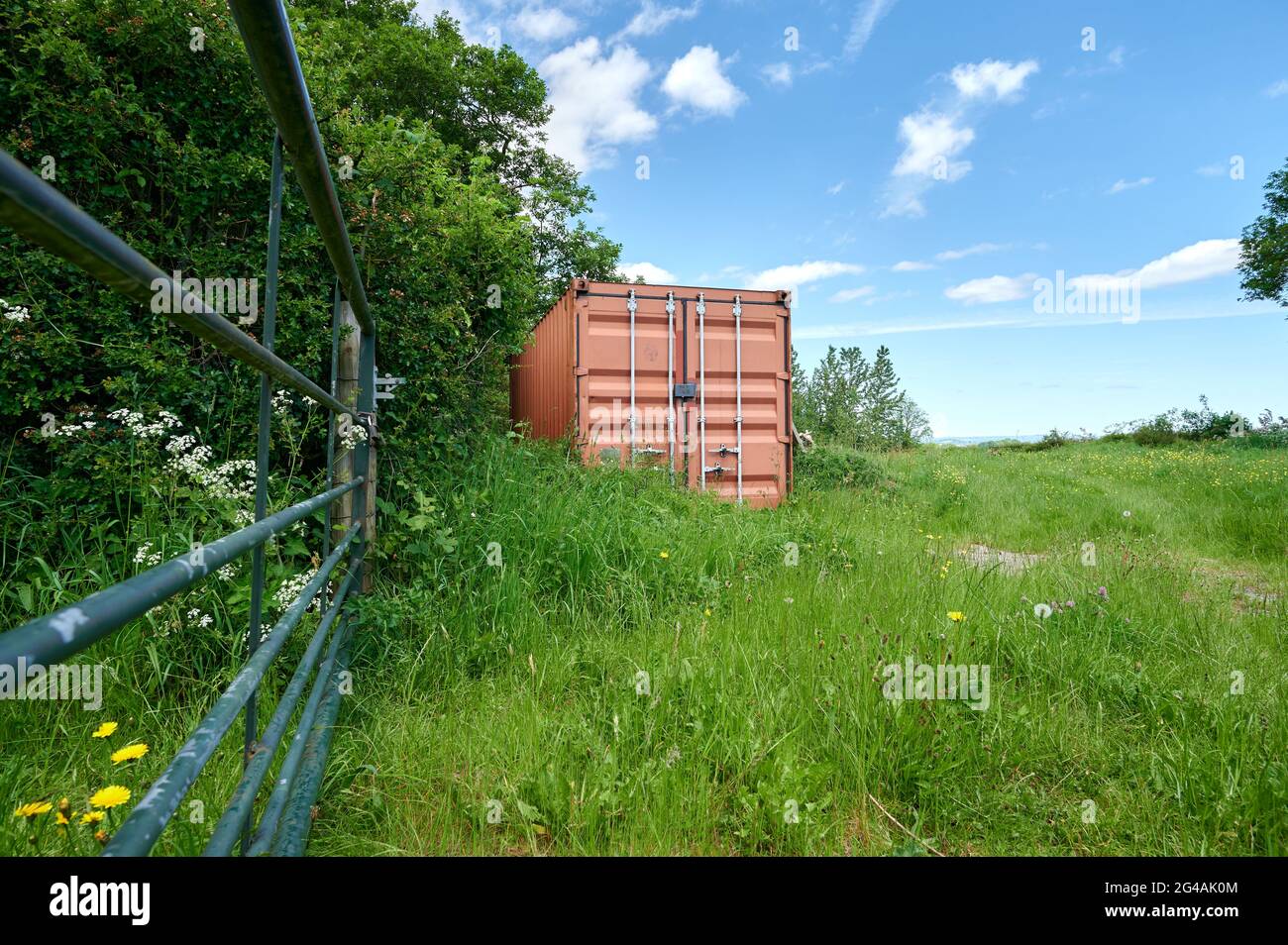 Herefordshire / UK - 6 June 2021: Mud coloured brown shipping container ...