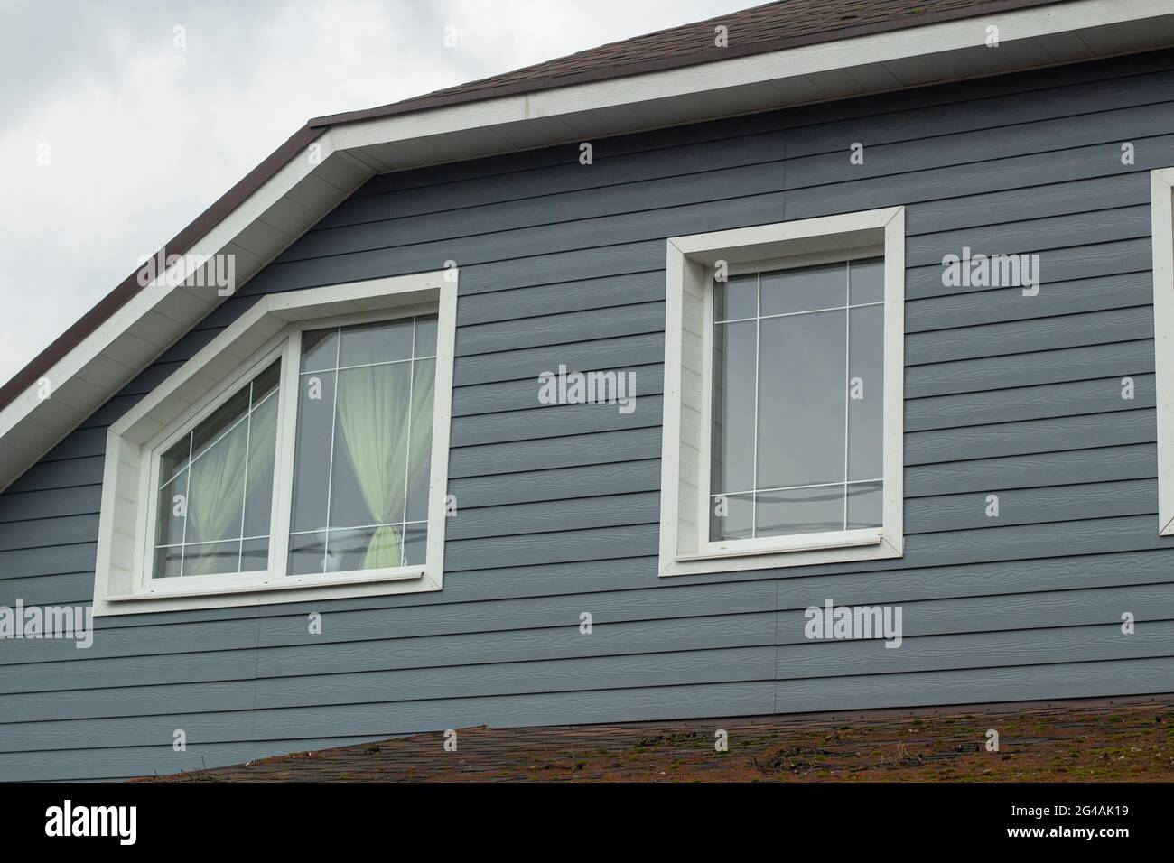 Country house outside the city. Residential building windows. Cozy ...