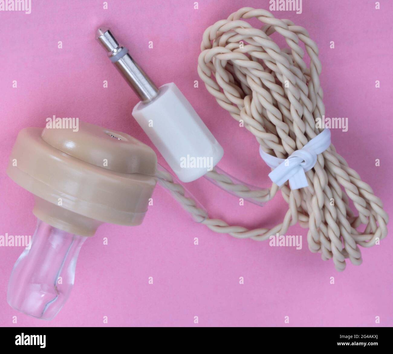 Plastic Headphones on Pink Background Stock Photo - Alamy