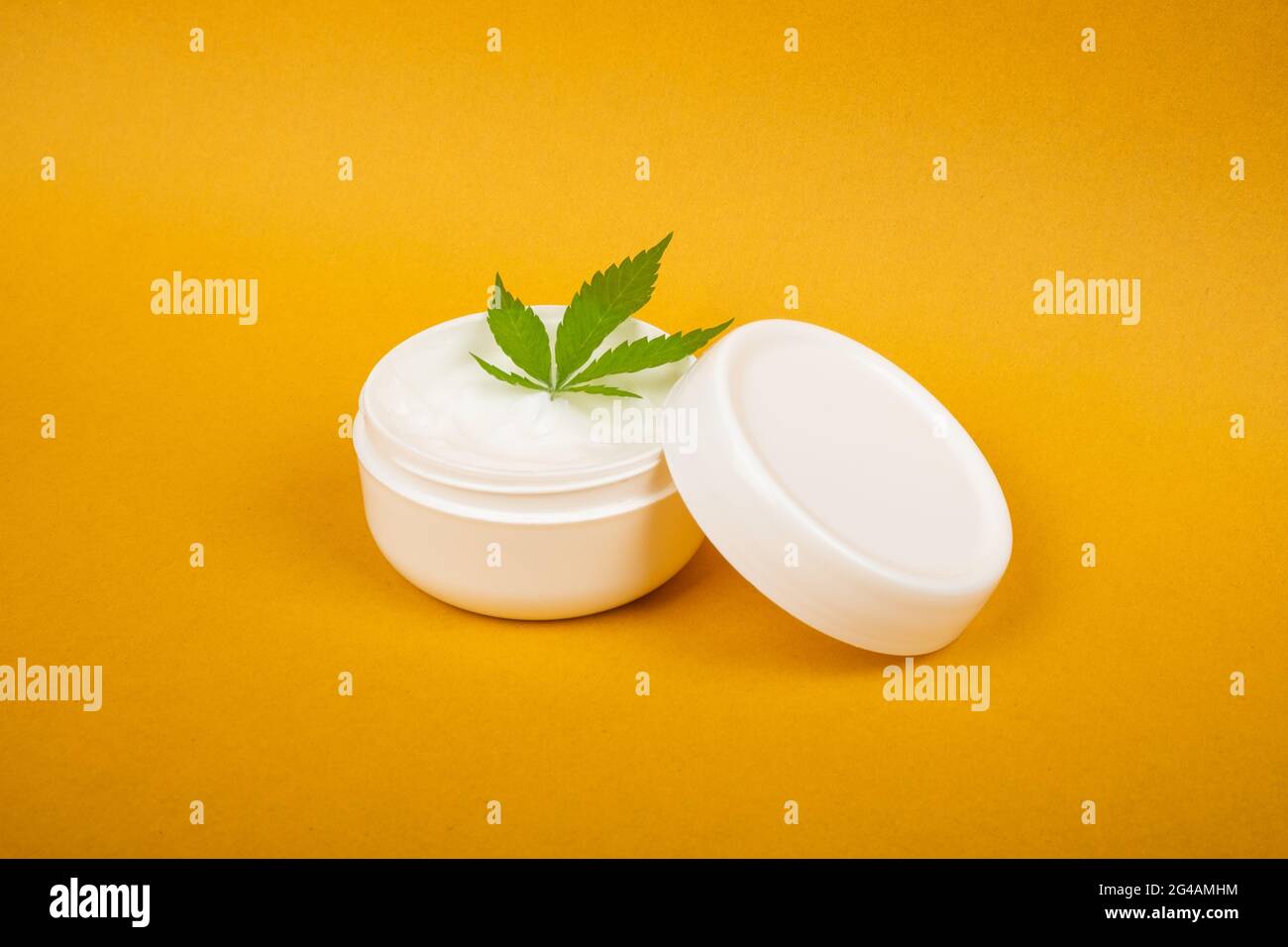 cannabis cosmetics , natural marijuana cream and green leaf on beauty ...