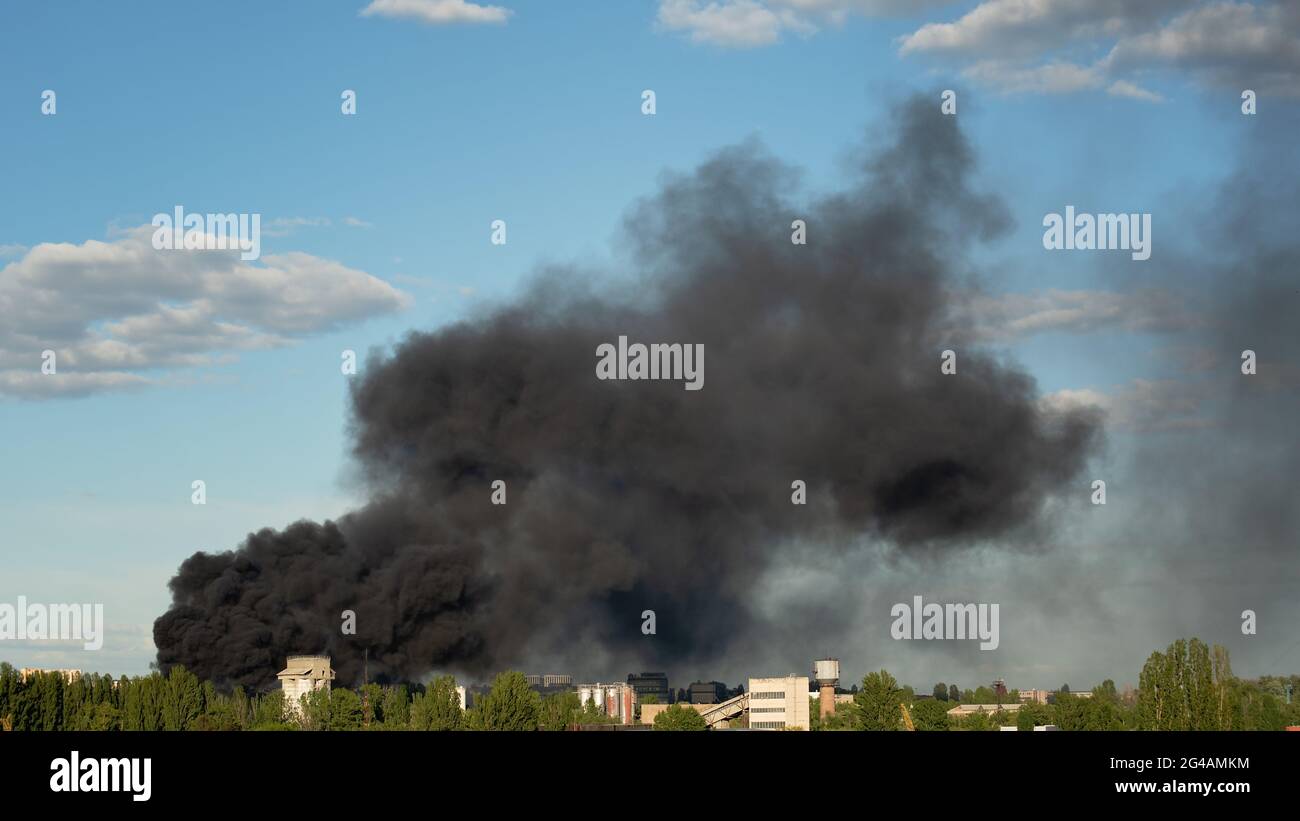 Burning building with black smoke. factory fire burning. Huge smoke ...
