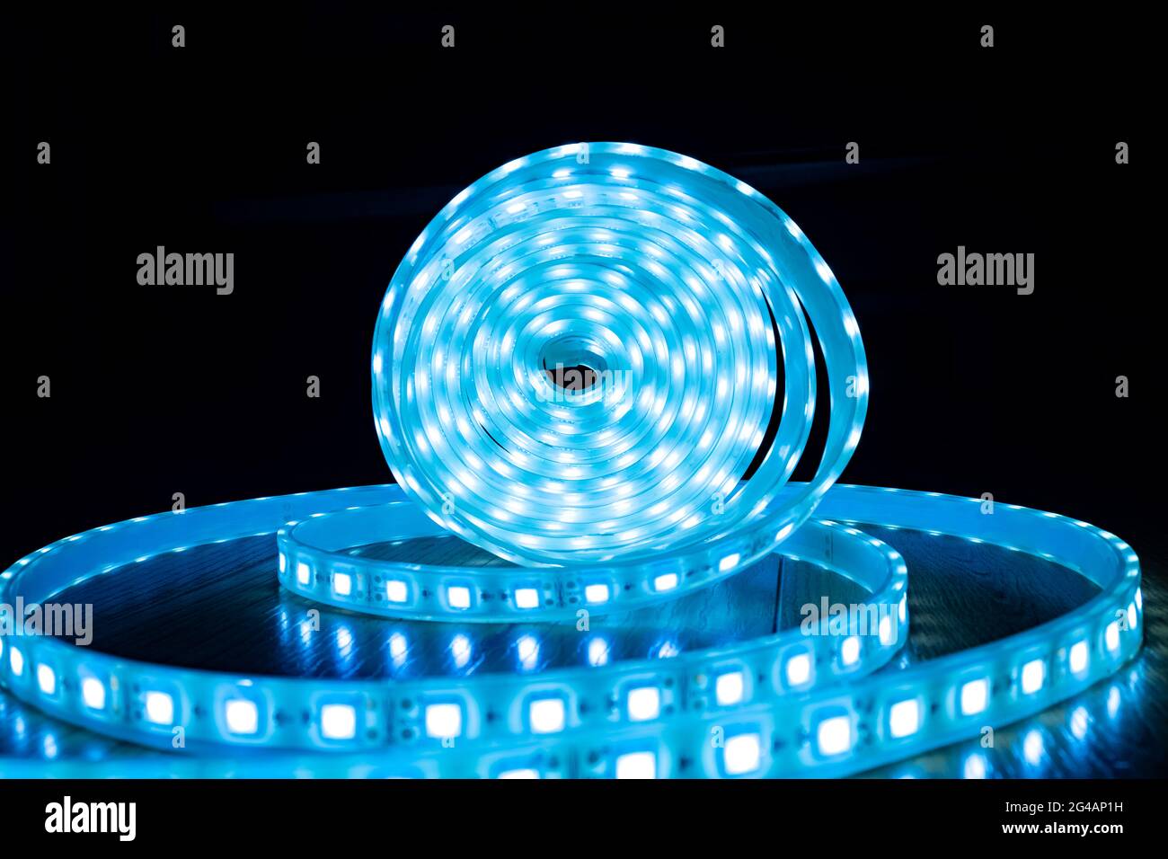 babin of glowing decorative LED strip of blue cold color on a black ...