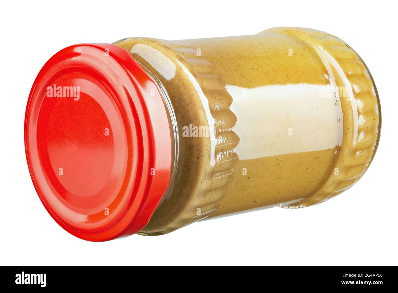 Mustard in a transparent glass jar with a closed red metal lid isolated ...