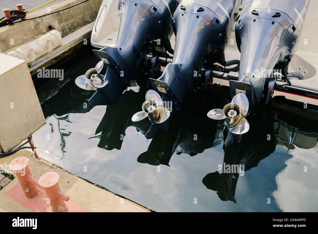 Three outboard boat motors Stock Photo - Alamy